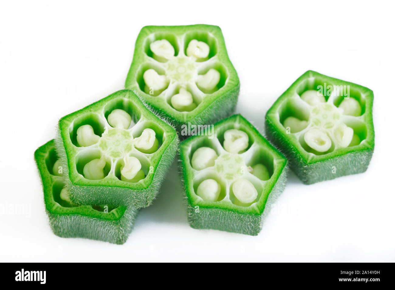 sliced okra isolated on white background Stock Photo - Alamy