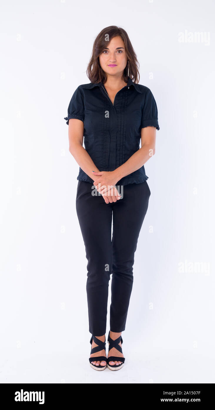 Full body shot of beautiful businesswoman looking at camera Stock Photo ...