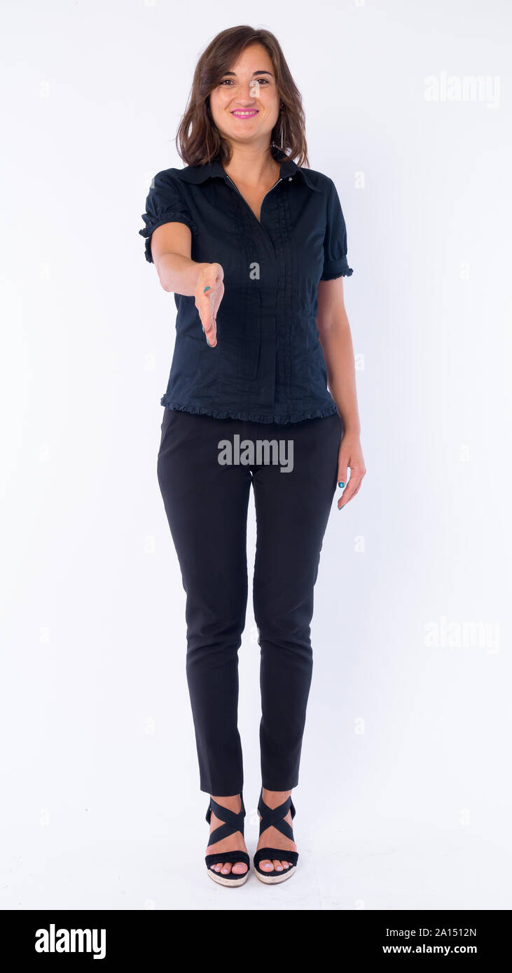 Full body shot of happy beautiful businesswoman giving handshake Stock ...