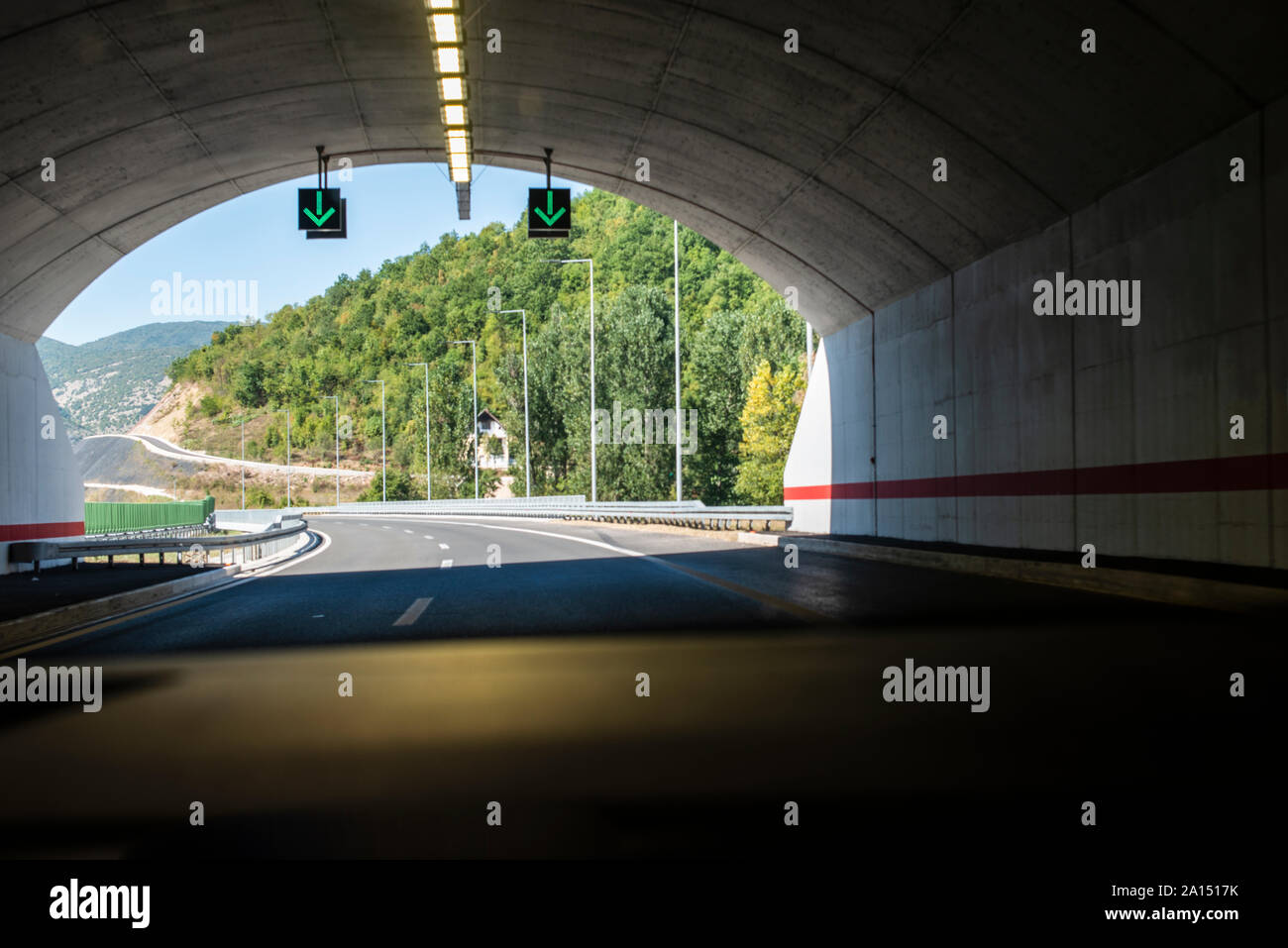 Highway tunnel. Signs in tunnel. Mountain road. Travel and traffic ...