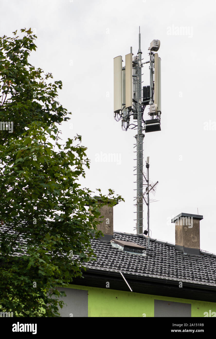 5G antennas on top of house. Antennas and transmitters on roof. High ...