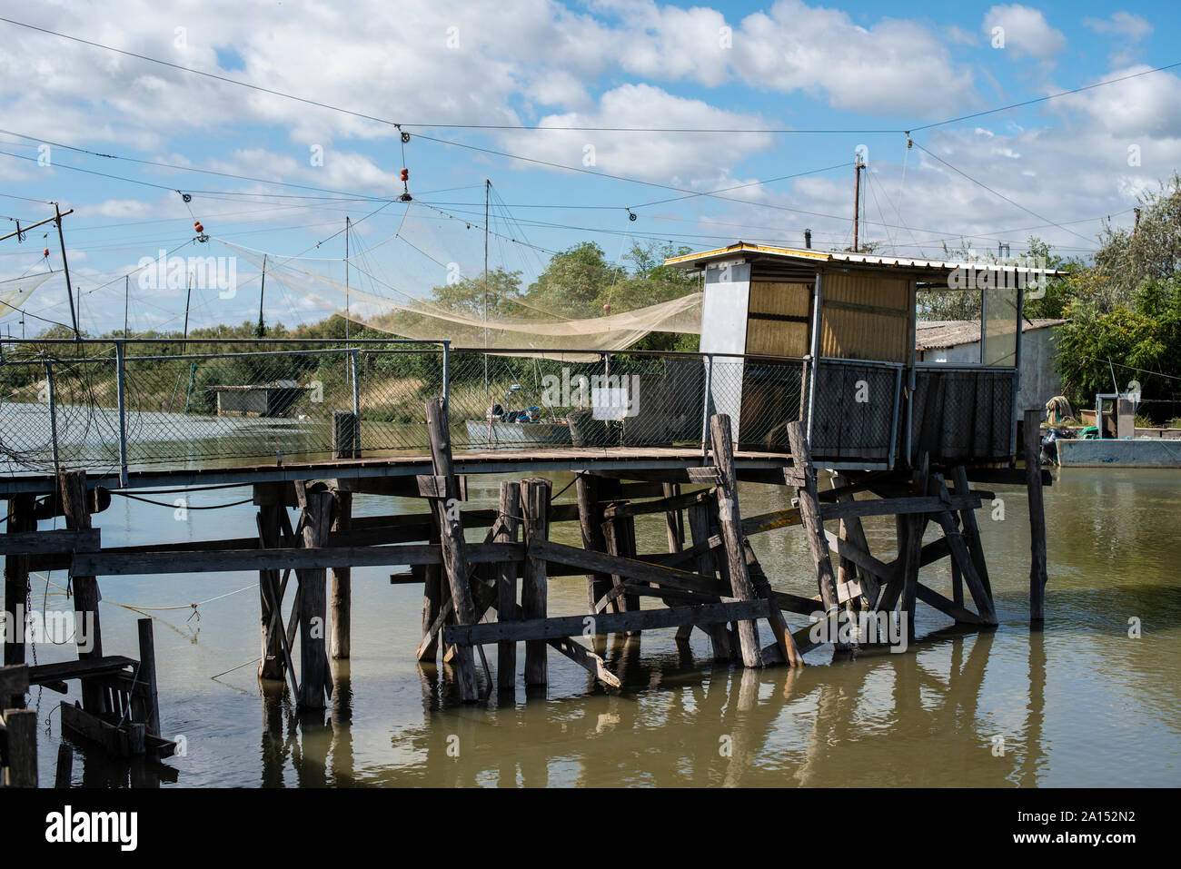 Fishing houses in dock and fishnet. Empty fishnets Stock Photo - Alamy