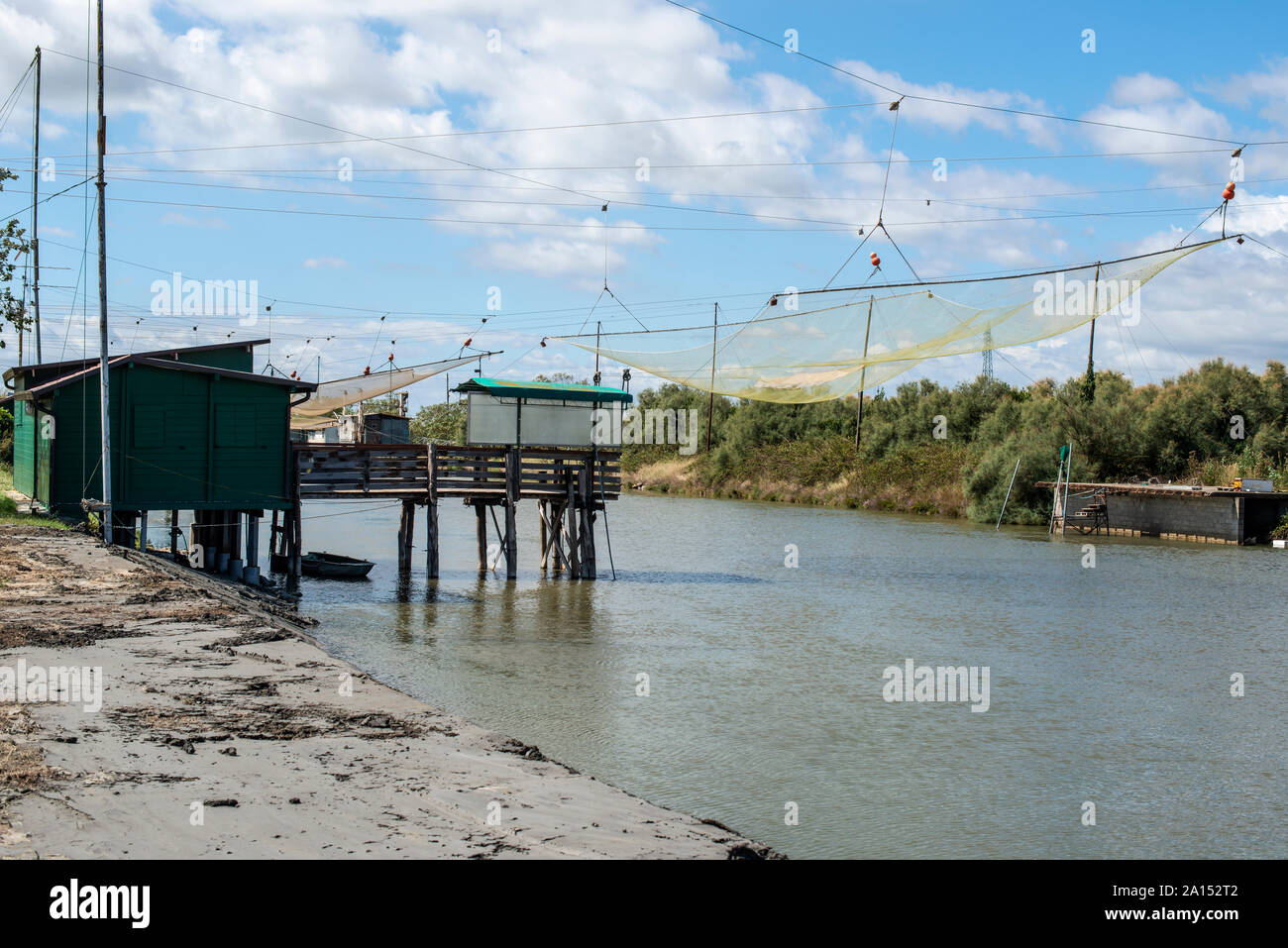 Fishing houses in dock and fishnet. Empty fishnets Stock Photo - Alamy