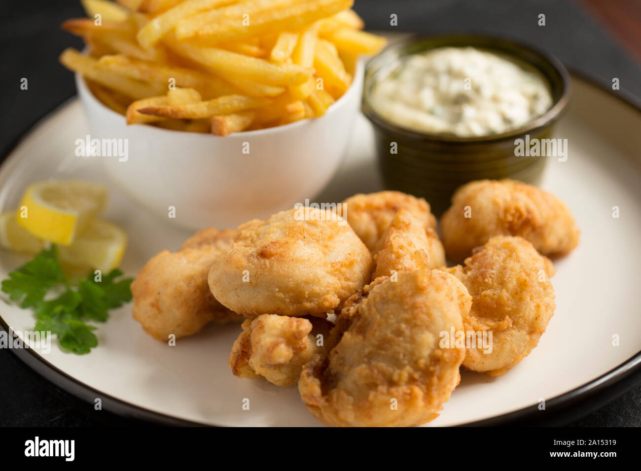 Ray cheeks that have been coated in flour and deep fried and served ...