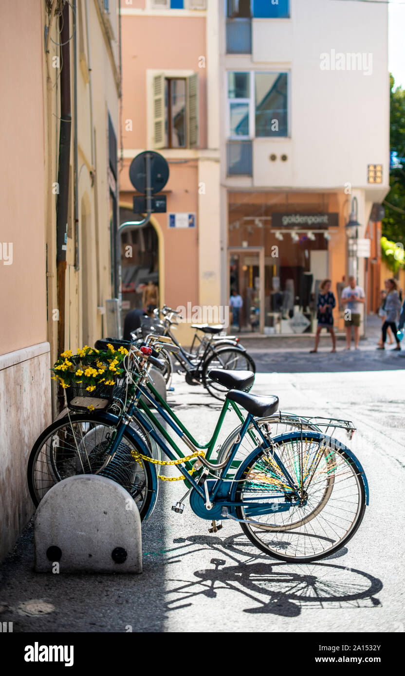 Bikes mounted on a bicycle stand on italian street Stock Photo - Alamy