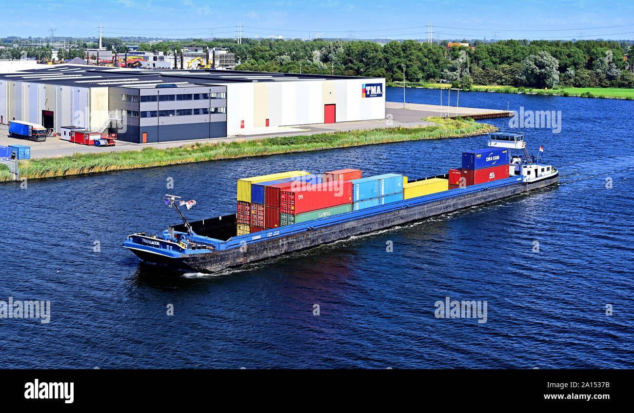 Small container ship Traviata passing TMA Group buildings in the North ...