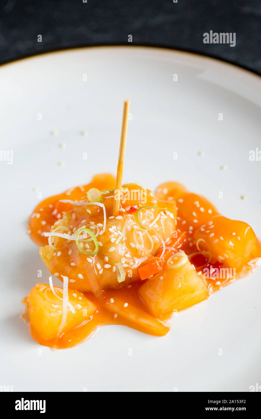 A ray cheek that has been deep fried in batter and served with a sweet ...