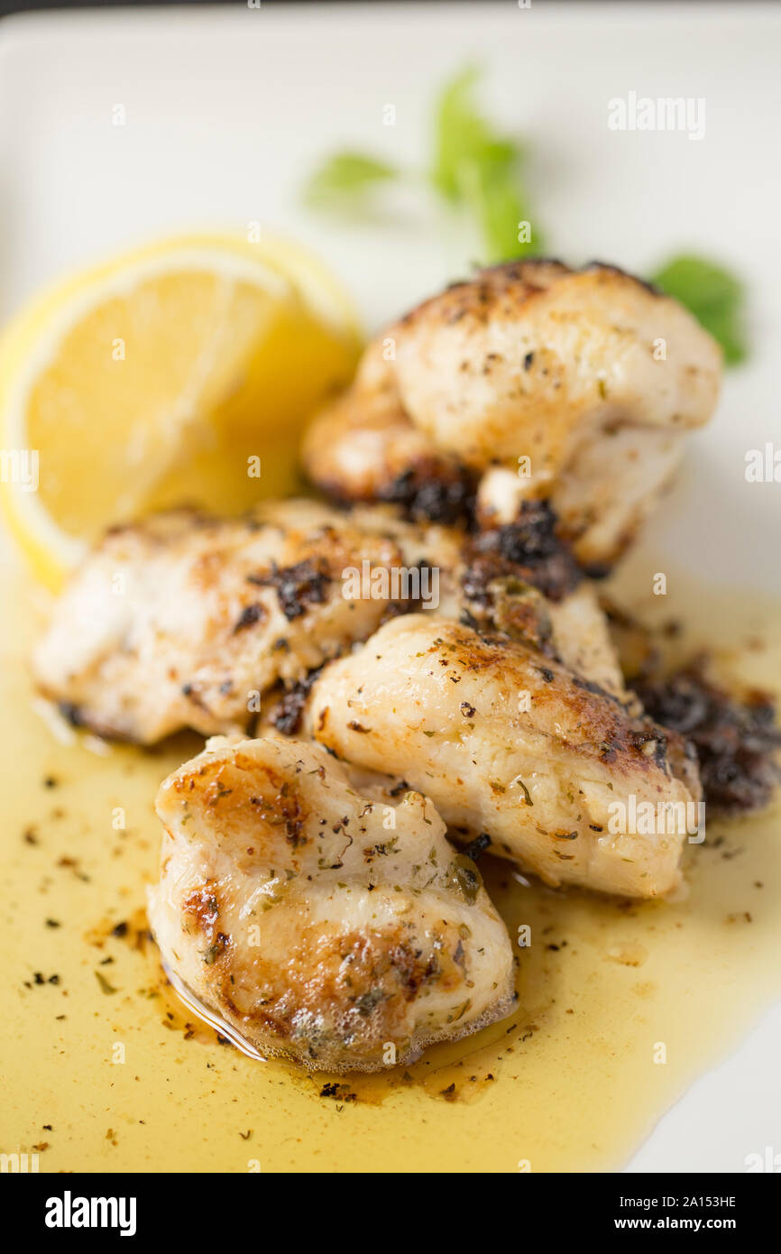 Ray cheeks that have been fried in butter, garlic and herbs with ...