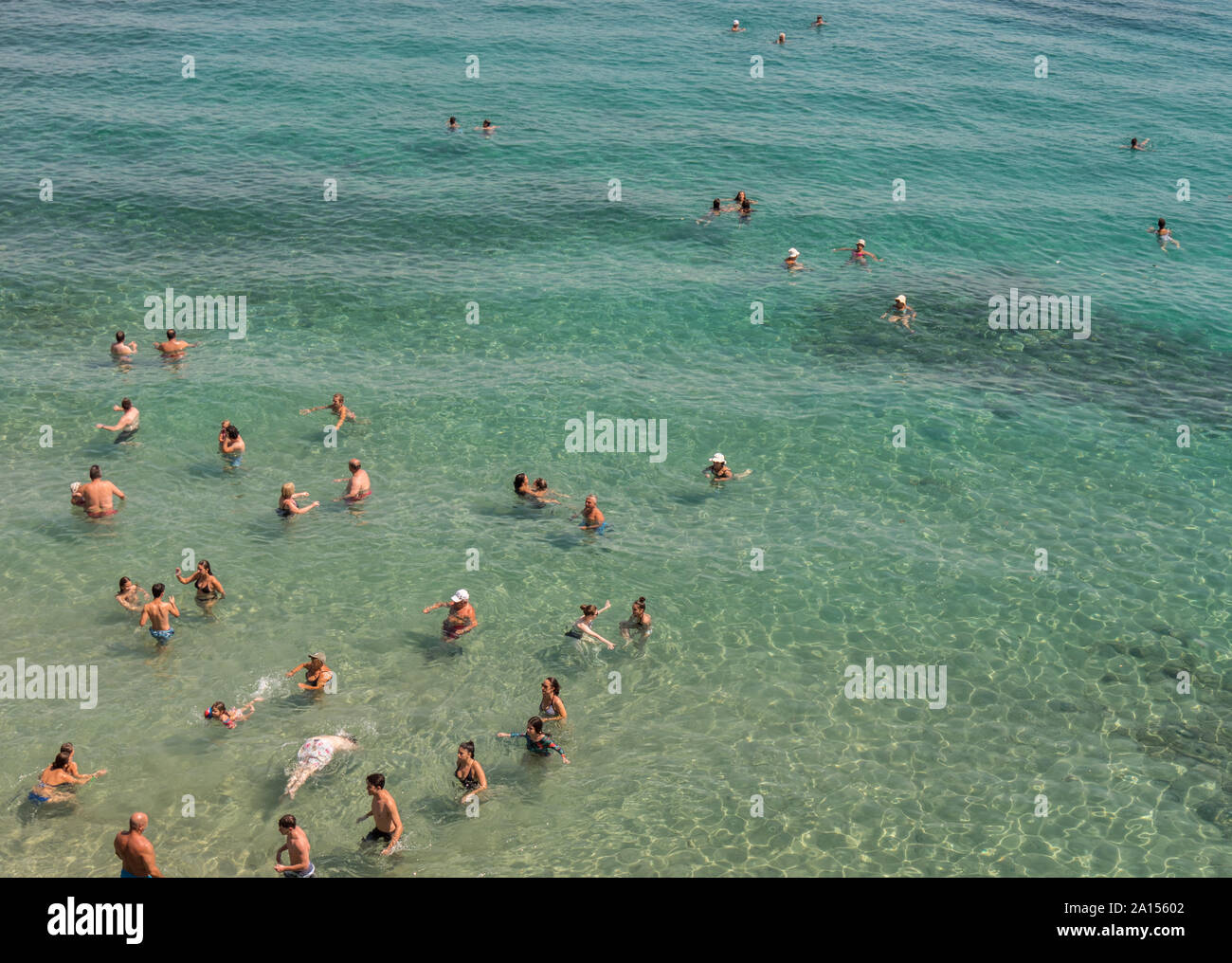 People swimming in a turquoise sea off the coast of Corfu Stock Photo ...