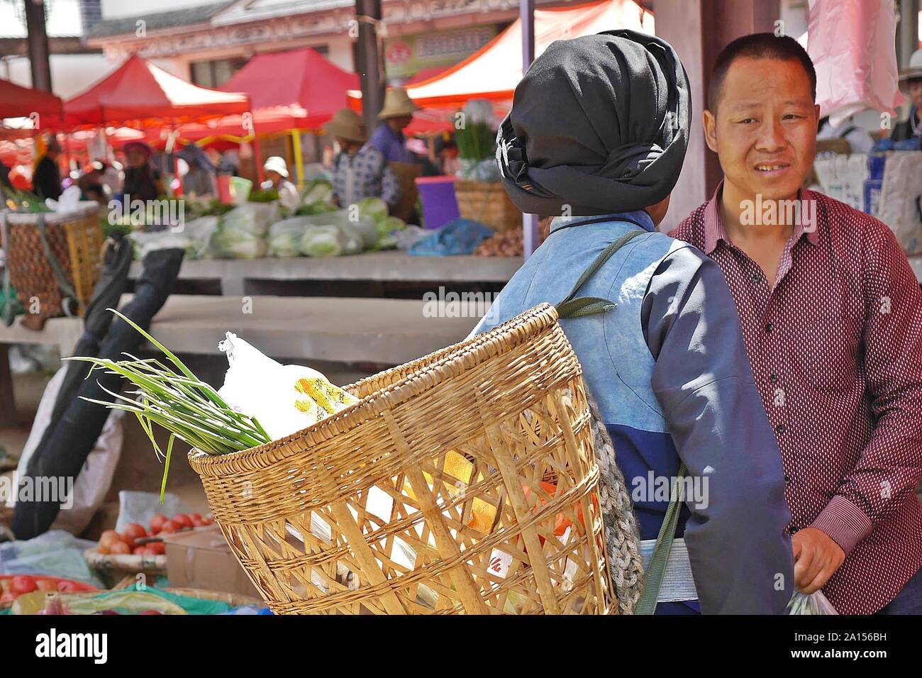 Local ethnic groups of people sell and buy products at Friday flea ...