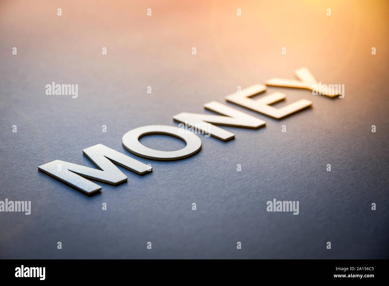 Word money written with white solid letters on a board Stock Photo - Alamy