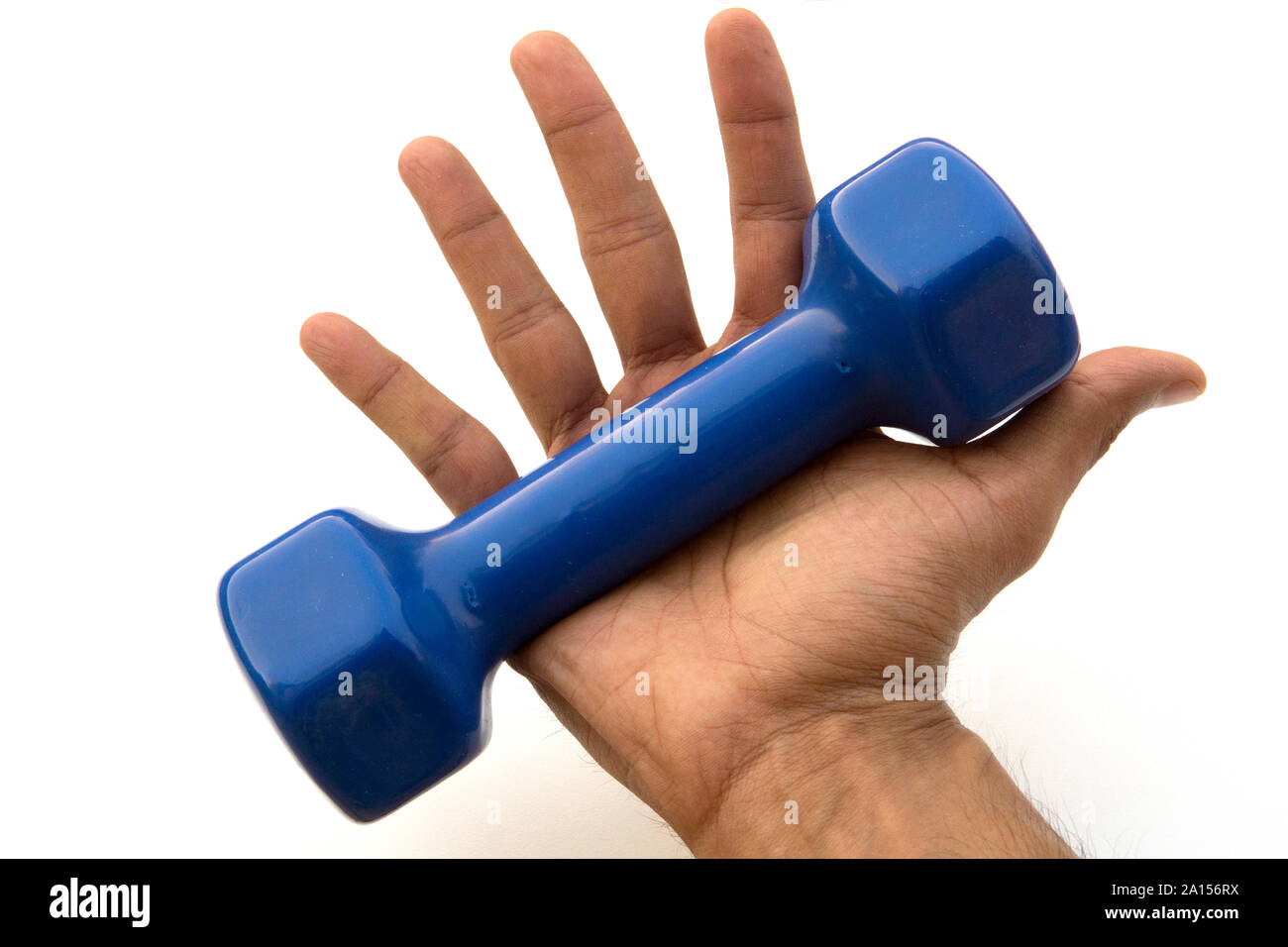 Brown hand holding a blue dumbbell on white background. Lifting weights ...
