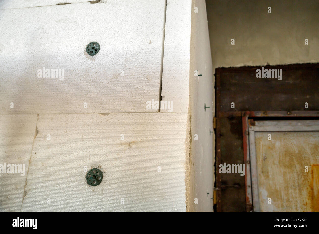 Insulation work of house walls with styrofoam sheets Stock Photo - Alamy