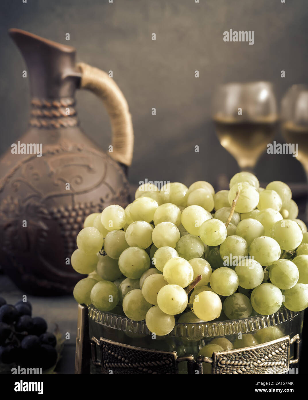 Grapes and wine in a jug and glasses Stock Photo - Alamy