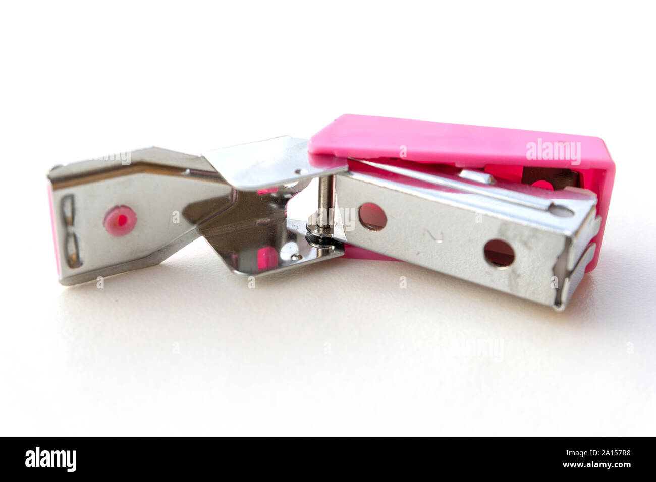 Small pink stapler isolated on white background Stock Photo - Alamy