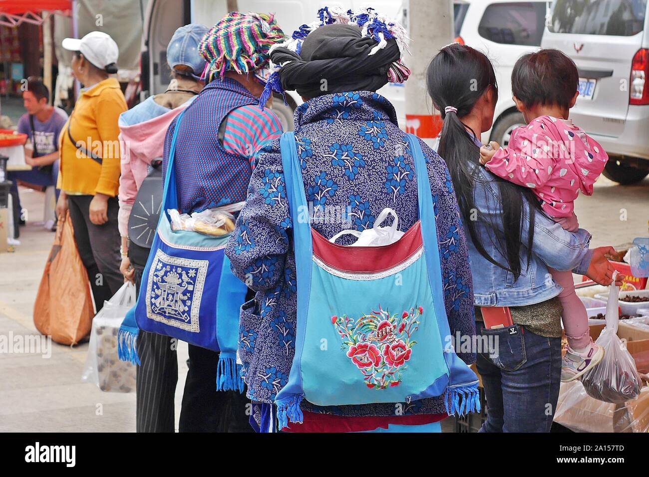 Local ethnic groups of people sell and buy products at Friday flea ...