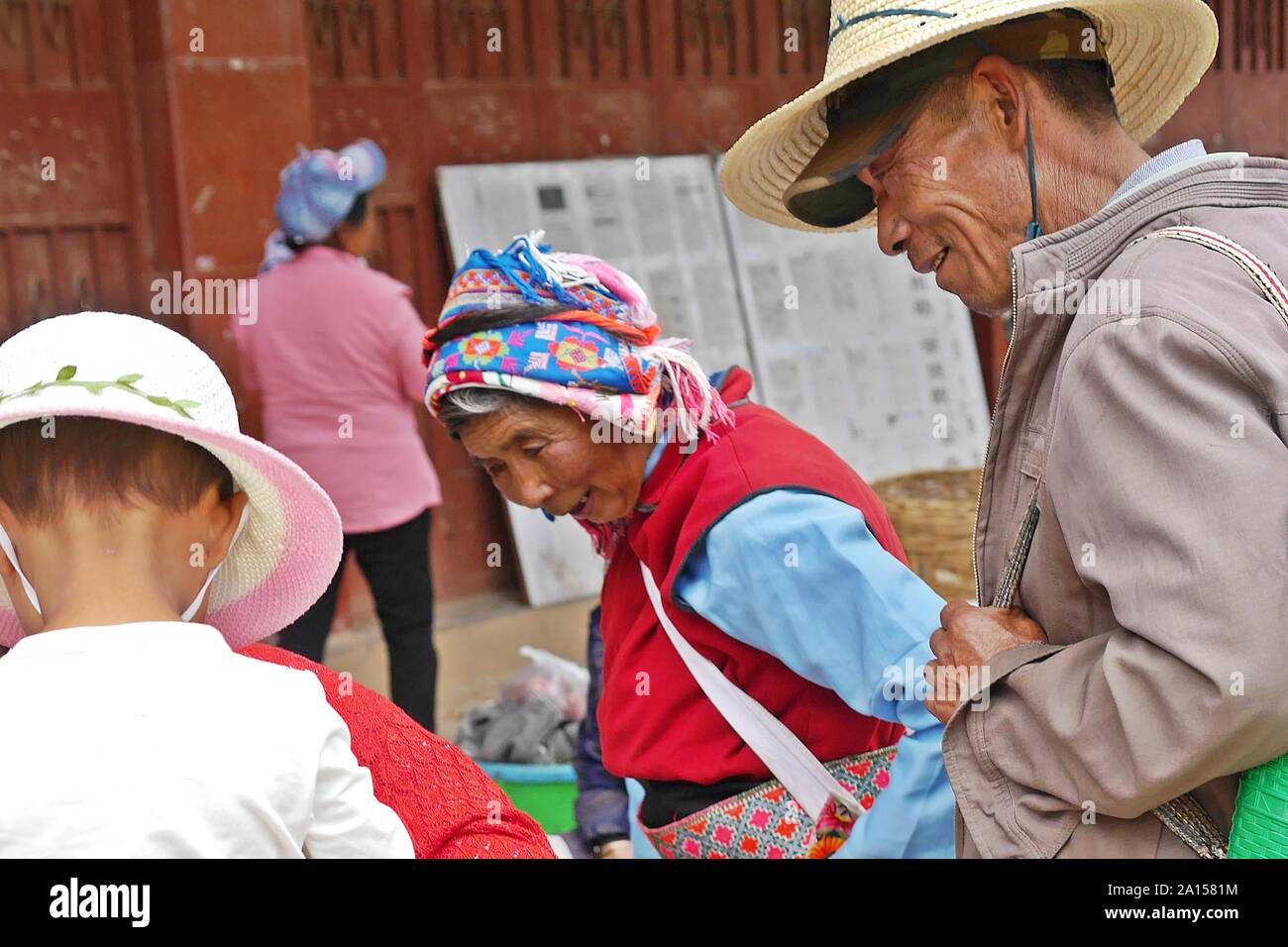 Local ethnic groups of people sell and buy products at Friday flea ...