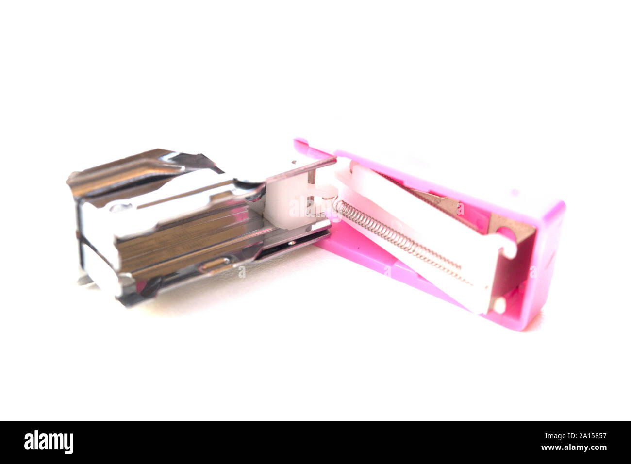 Small pink stapler isolated on white background Stock Photo - Alamy