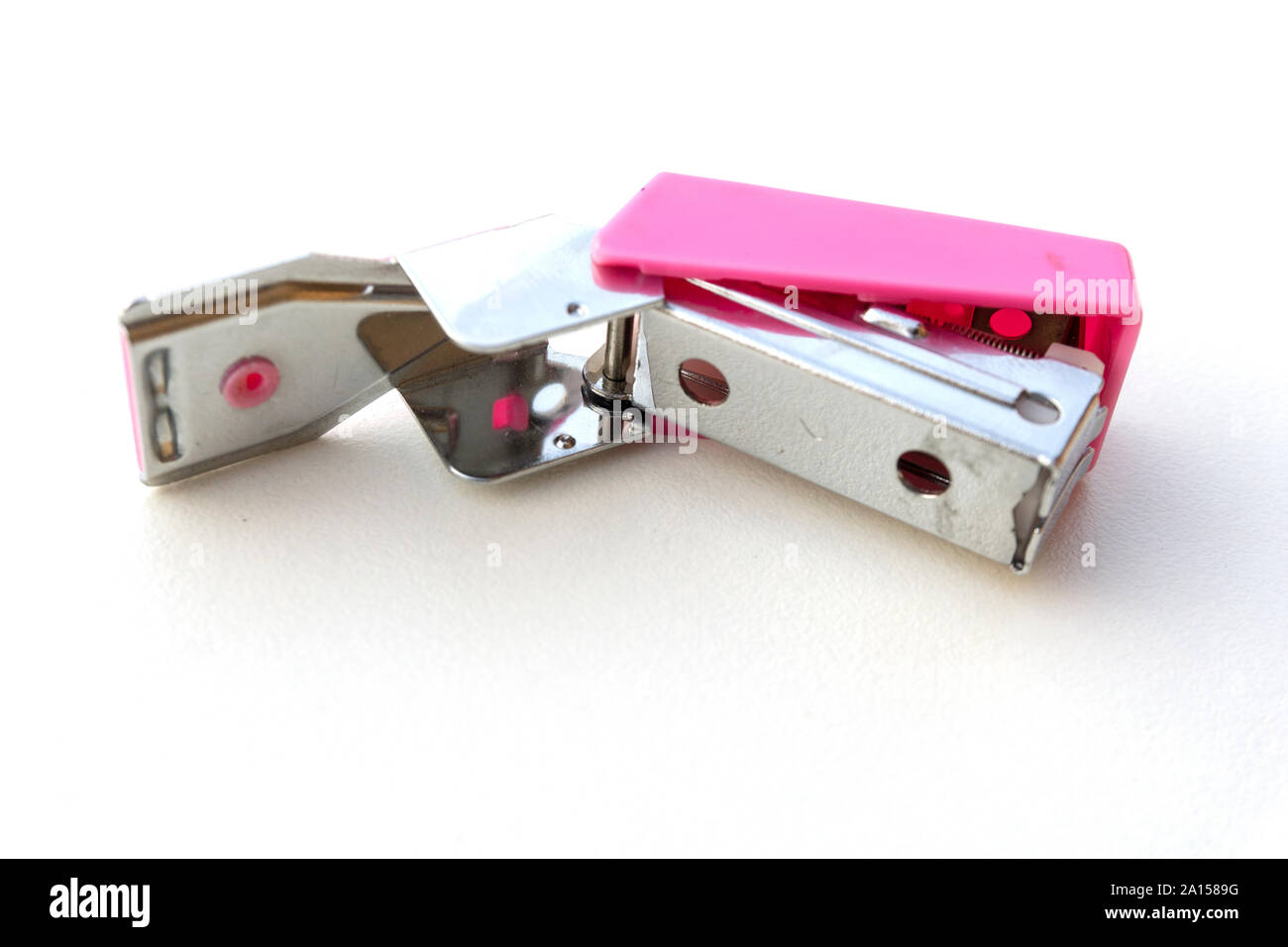Small pink stapler isolated on white background Stock Photo - Alamy
