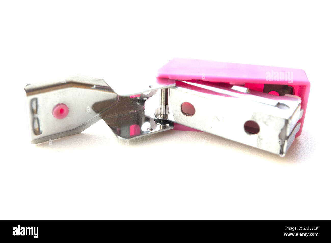 Small pink stapler isolated on white background Stock Photo - Alamy