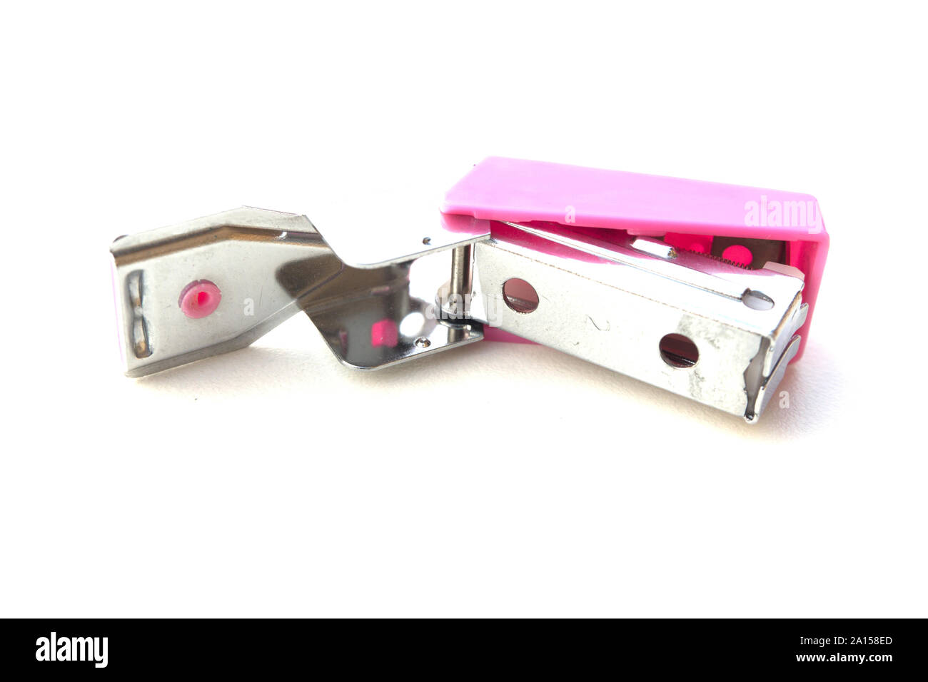 Small pink stapler isolated on white background Stock Photo - Alamy