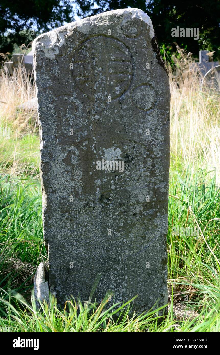 Early christian pillar stone with two ring type crosses carved carvings ...