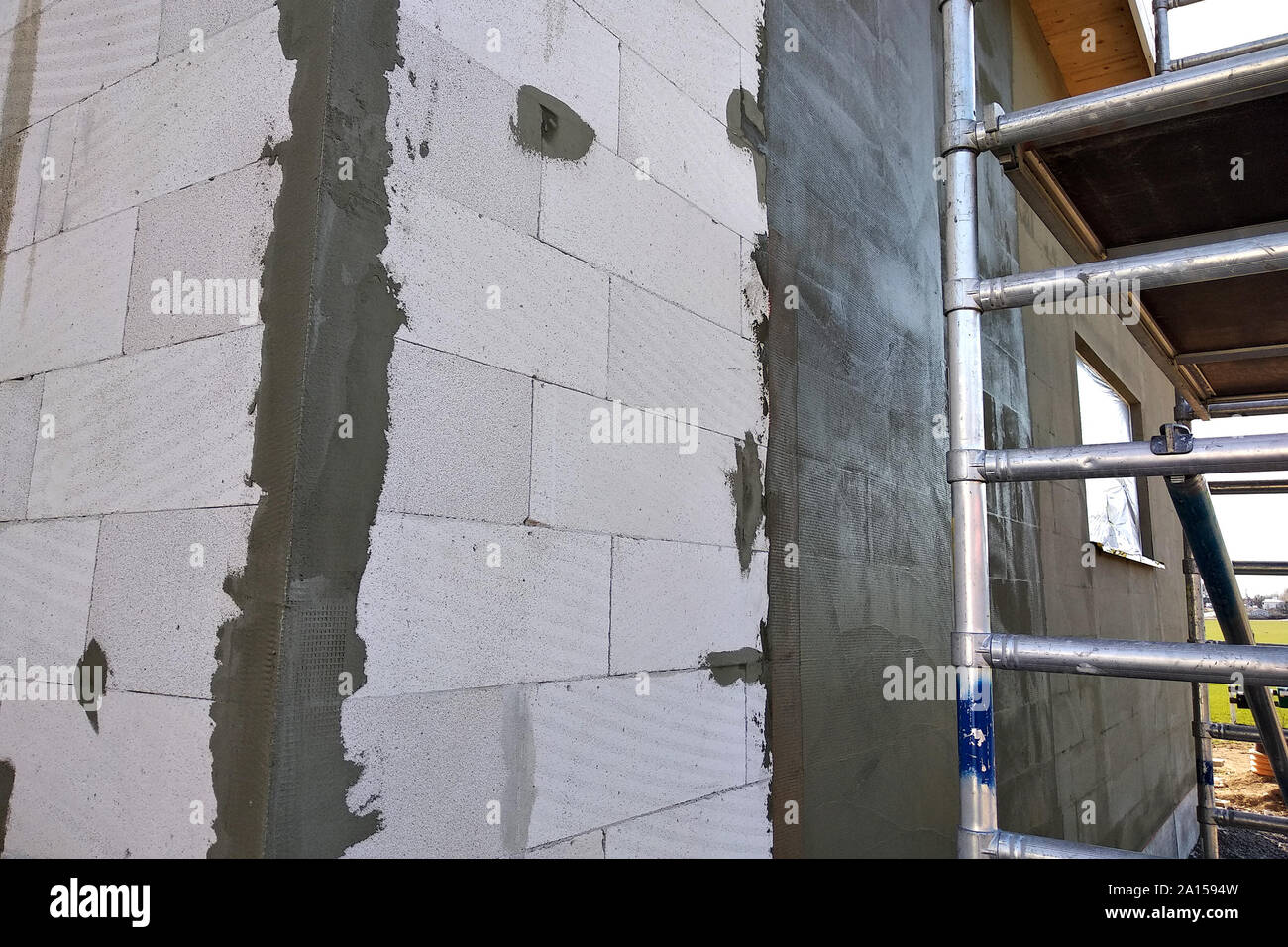 Facade of white block building under construction works Stock Photo - Alamy