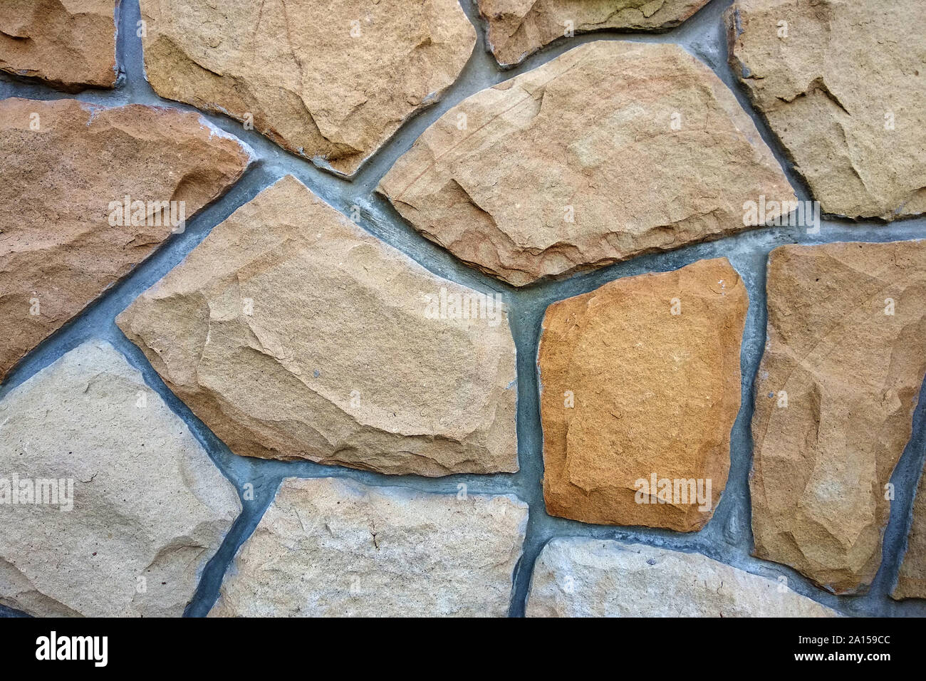 Sand stone wall for usage as background Stock Photo - Alamy