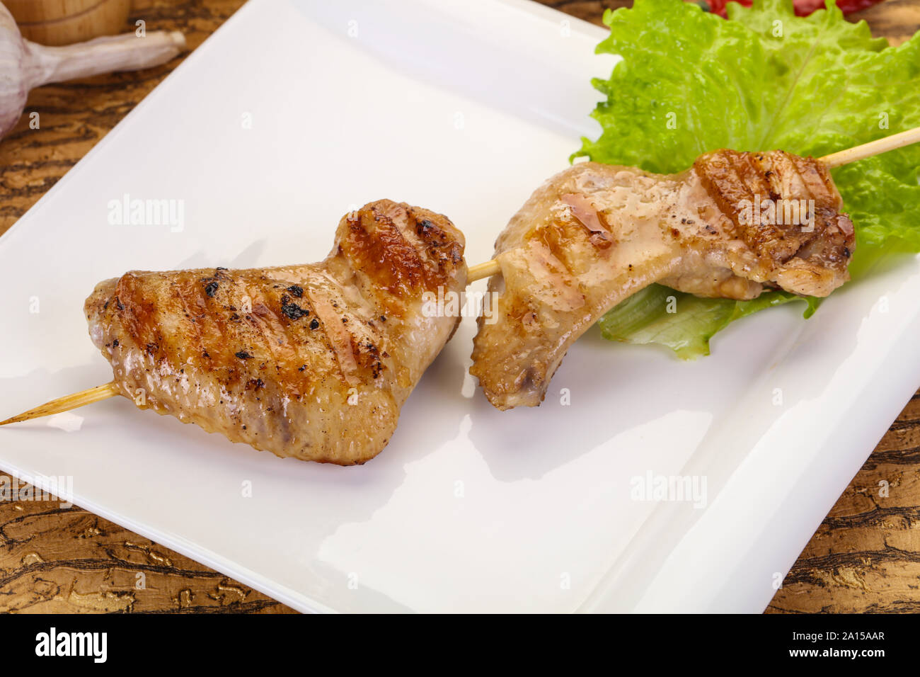 Chicken wings skewer with spicy sauce Stock Photo - Alamy