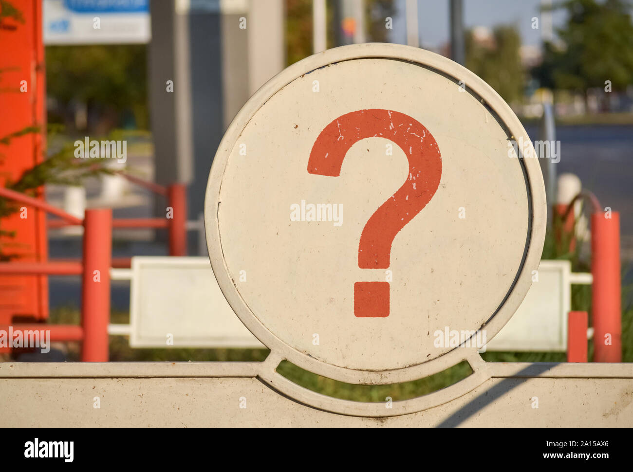 Red question mark written on a circular metal board Stock Photo - Alamy