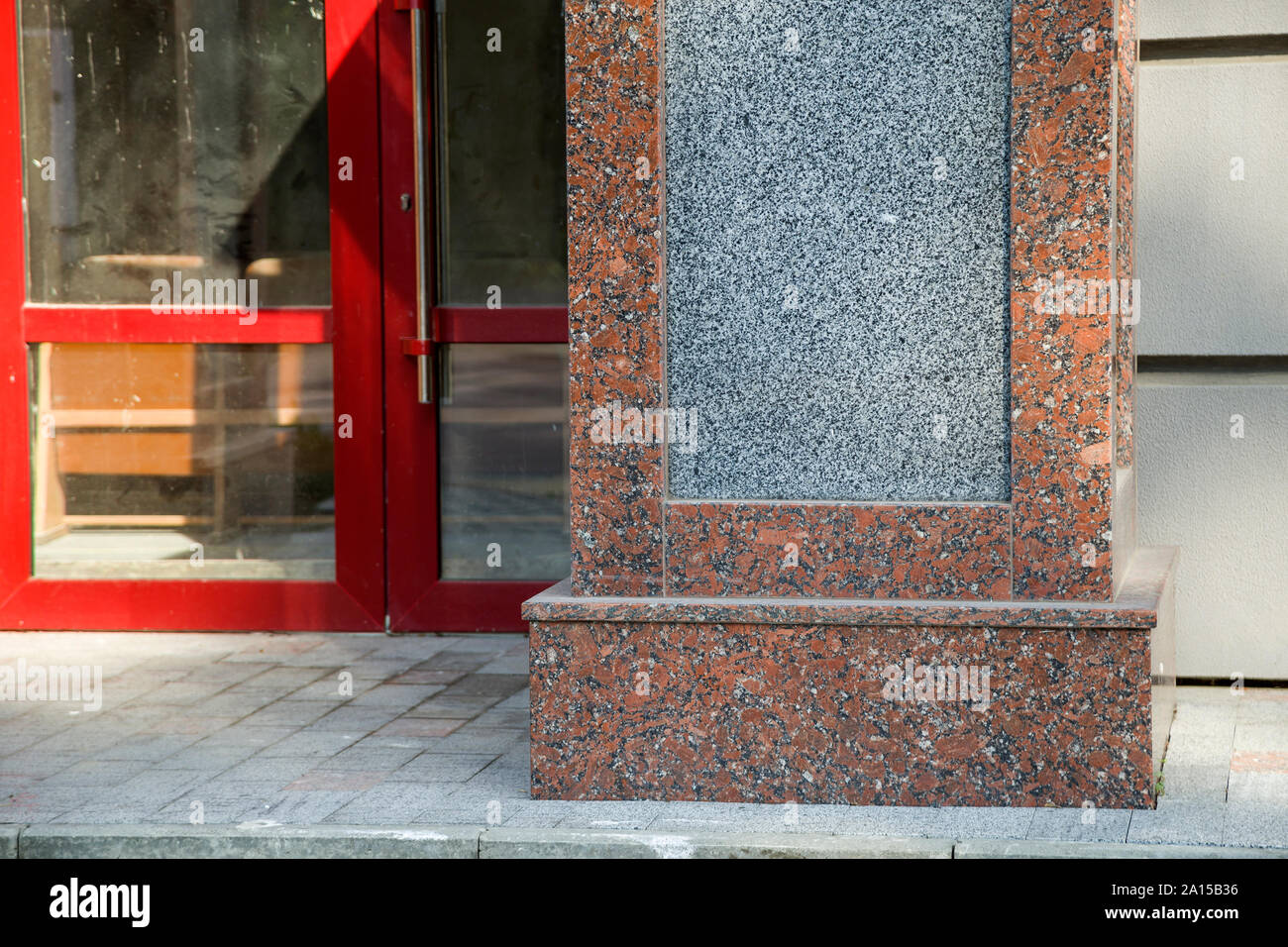 Detail of a house facade. Granite columns as decorative elements of the ...