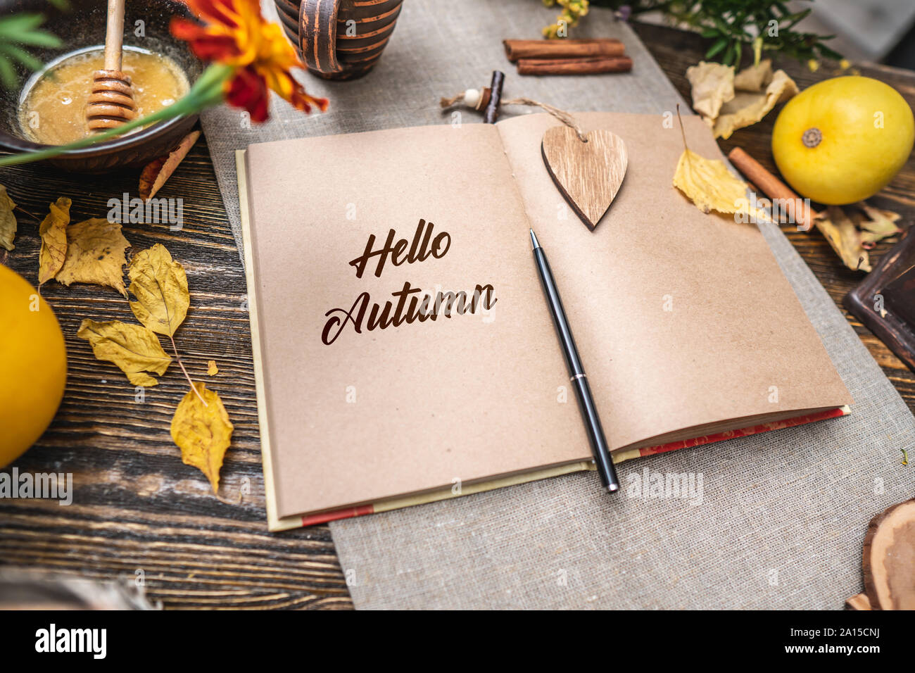 Autumn set of yellow leaves and flowers. Notebook with open pages on ...