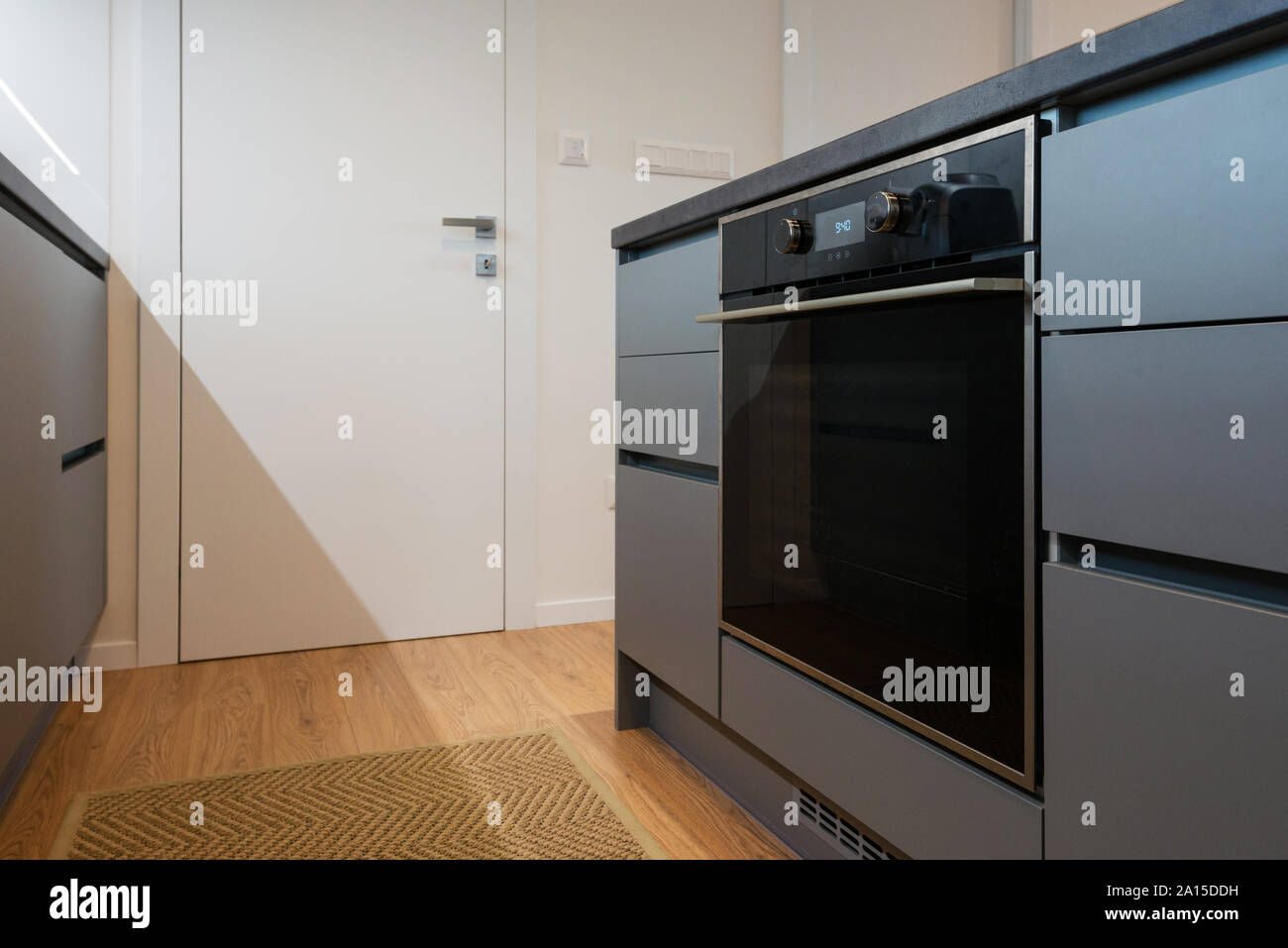 Interior of contemporary kitchen with built-in stove Stock Photo - Alamy