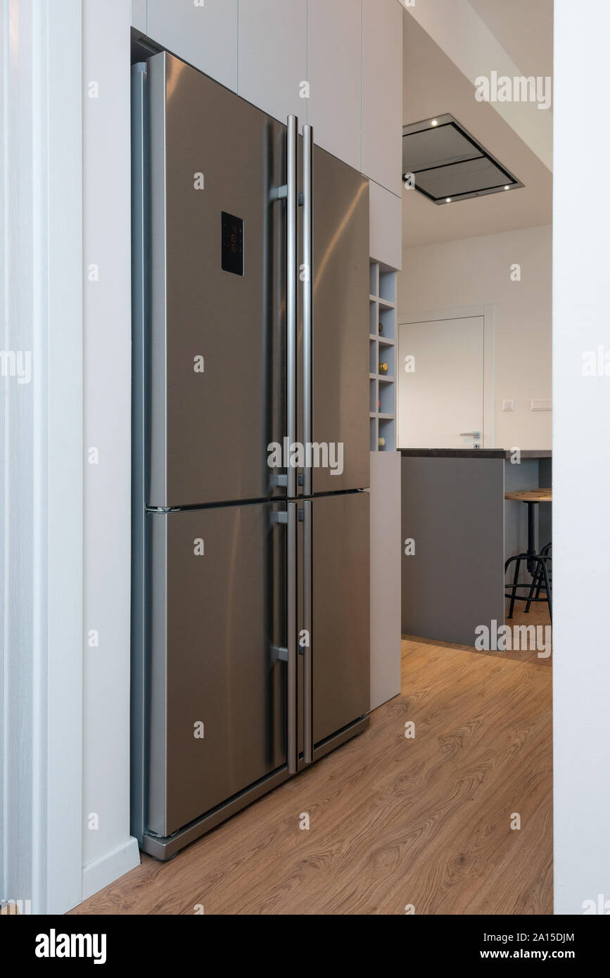 Interior of contemporary kitchen with built-in fridge Stock Photo - Alamy