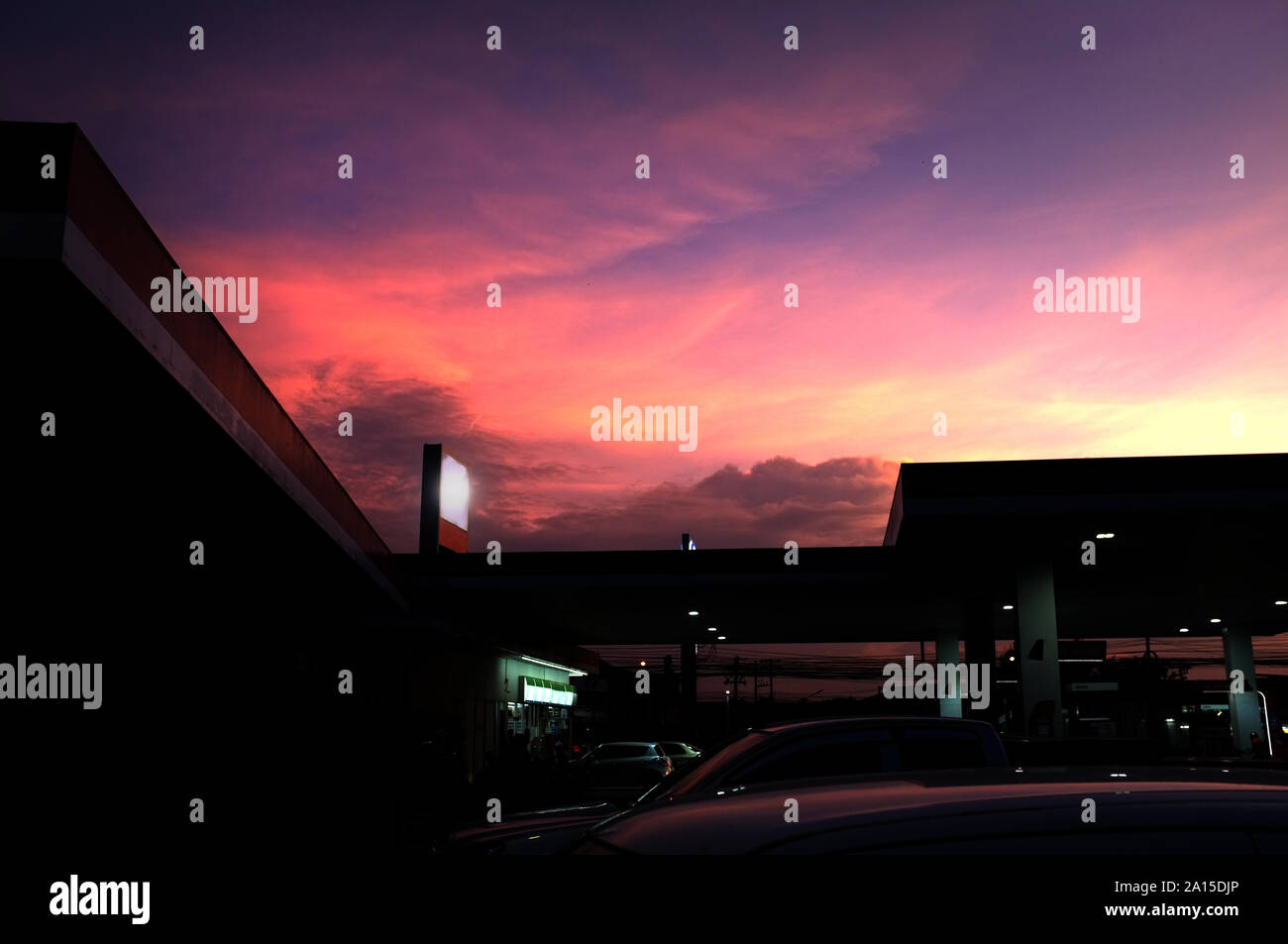 Gas station with clouds and sky at sunset Stock Photo - Alamy