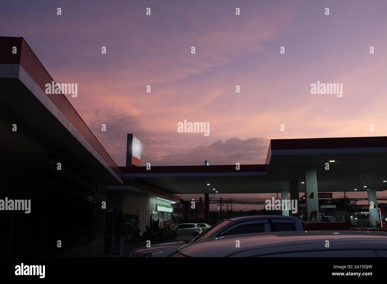 Gas station with clouds and sky at sunset Stock Photo - Alamy