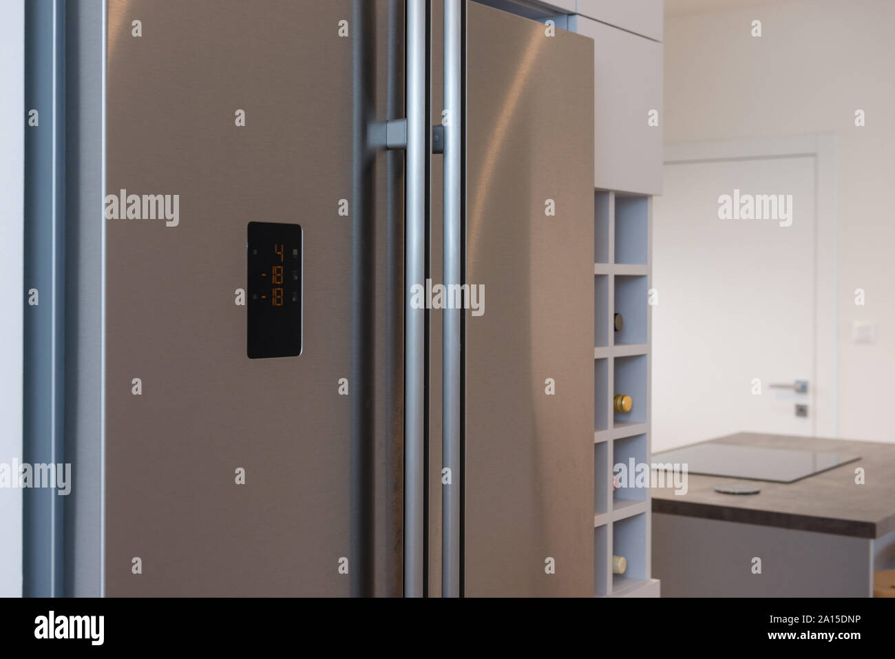 Interior of contemporary kitchen with built-in fridge Stock Photo - Alamy
