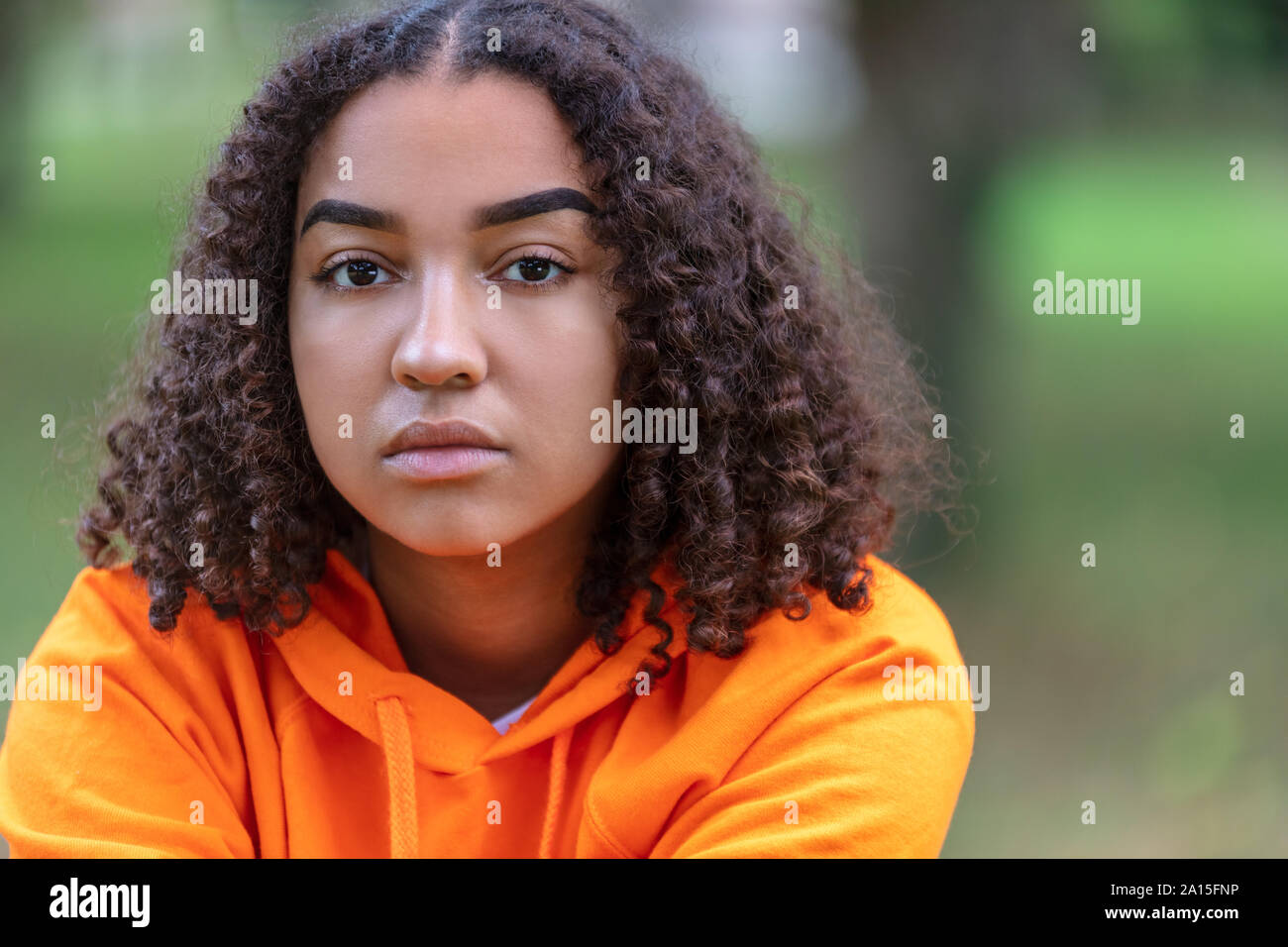 Outdoor portrait of beautiful sad, thoughtful or depressed mixed race ... Outdoor portrait of beautiful sad, thoughtful or depressed mixed race ...