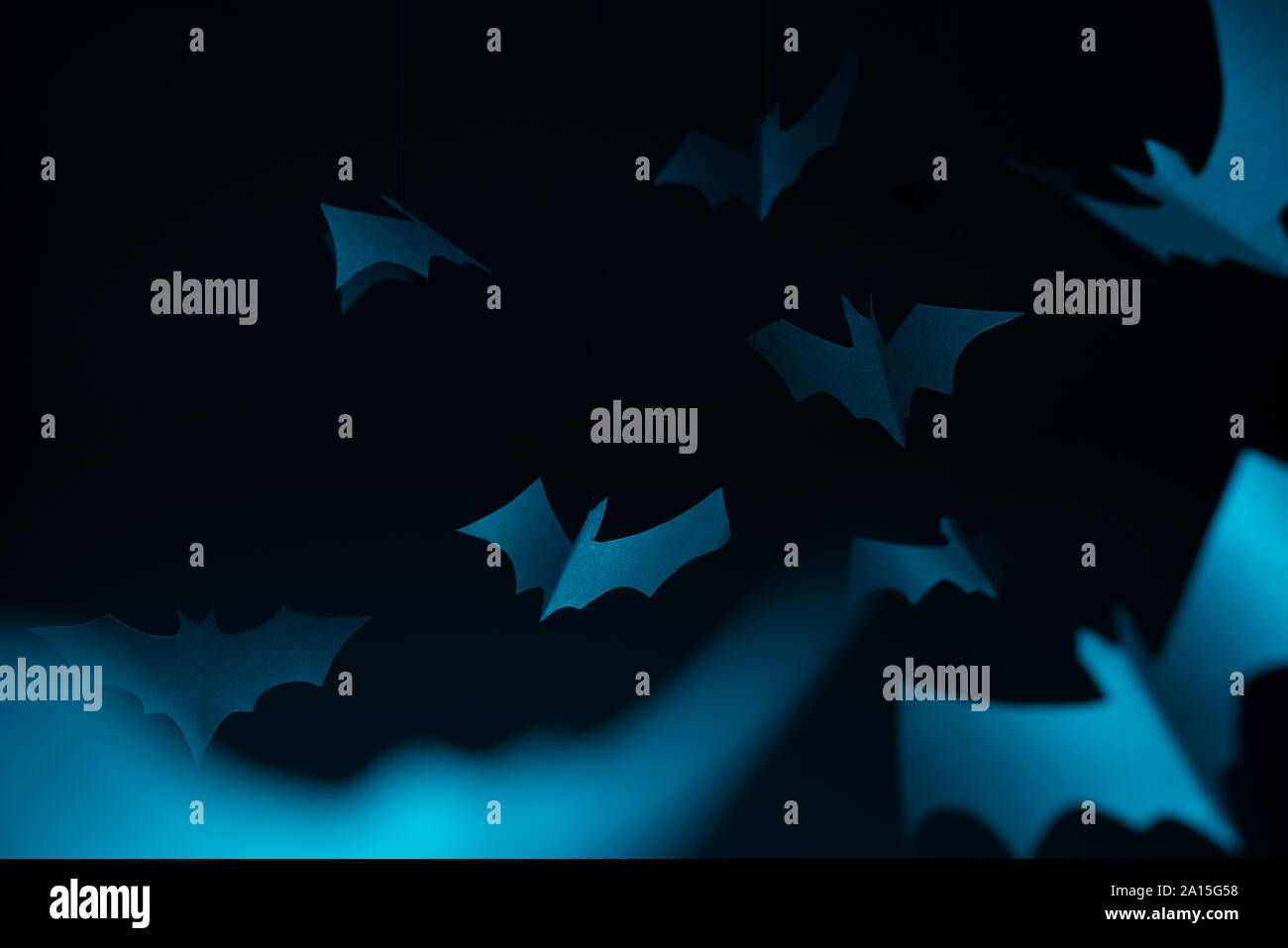 Halloween image of blue paper bats on blank dark blue background Stock ...
