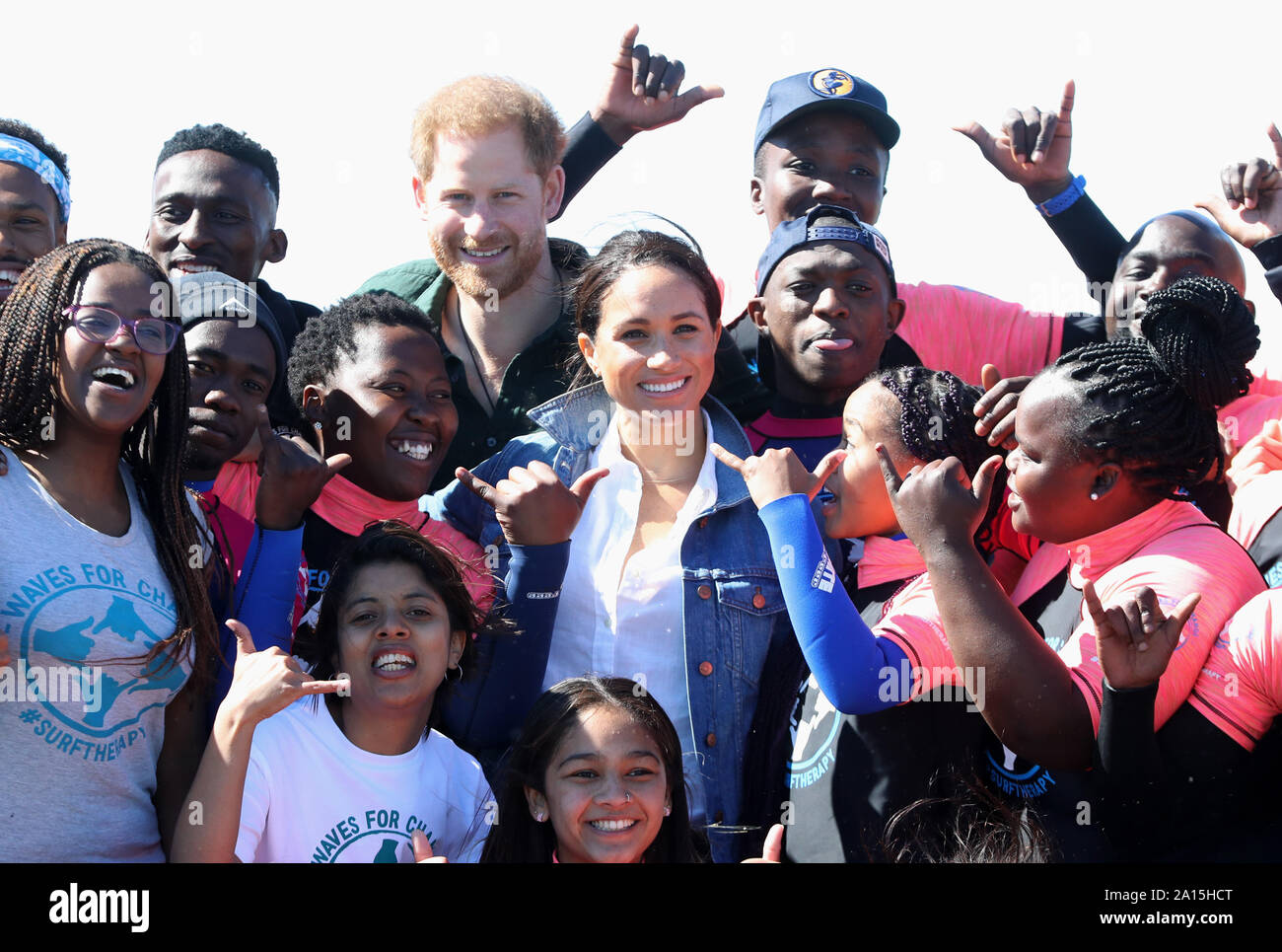 The Duke and Duchess of Sussex pose for a photograph with surf mentors ...