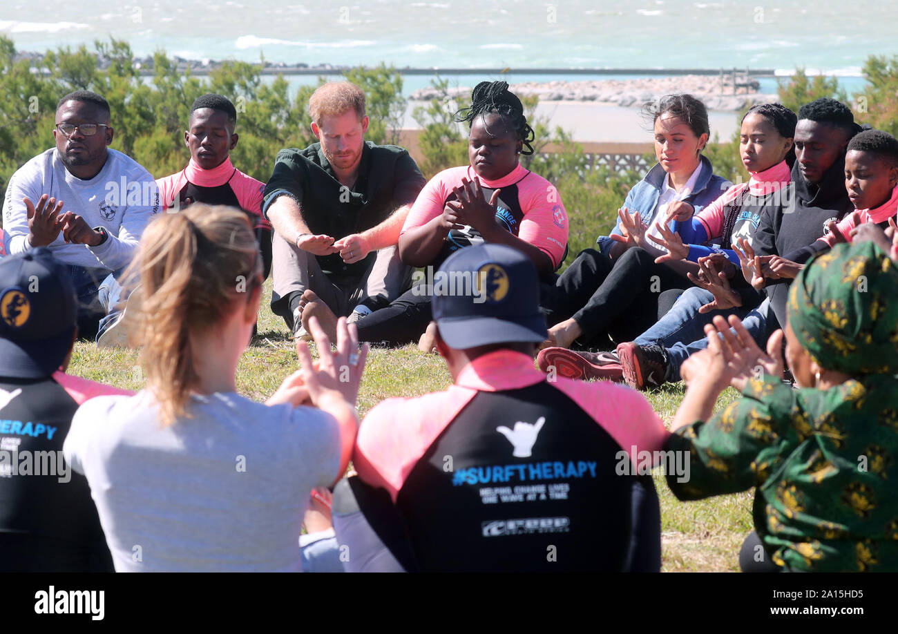 The Duke and Duchess of Sussex participate in a group activity to ...