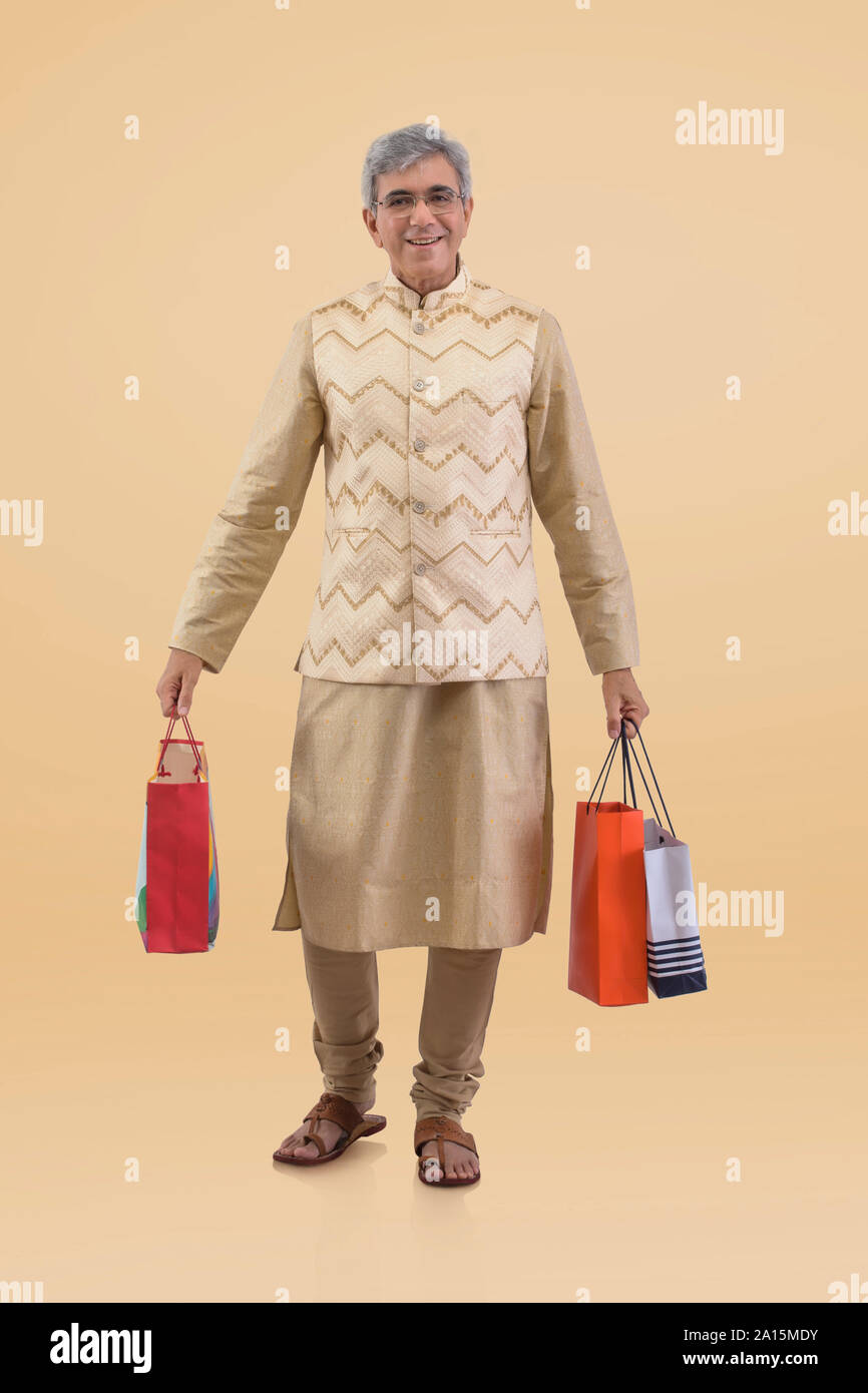 Portrait of a Old Man with shopping bags Stock Photo - Alamy