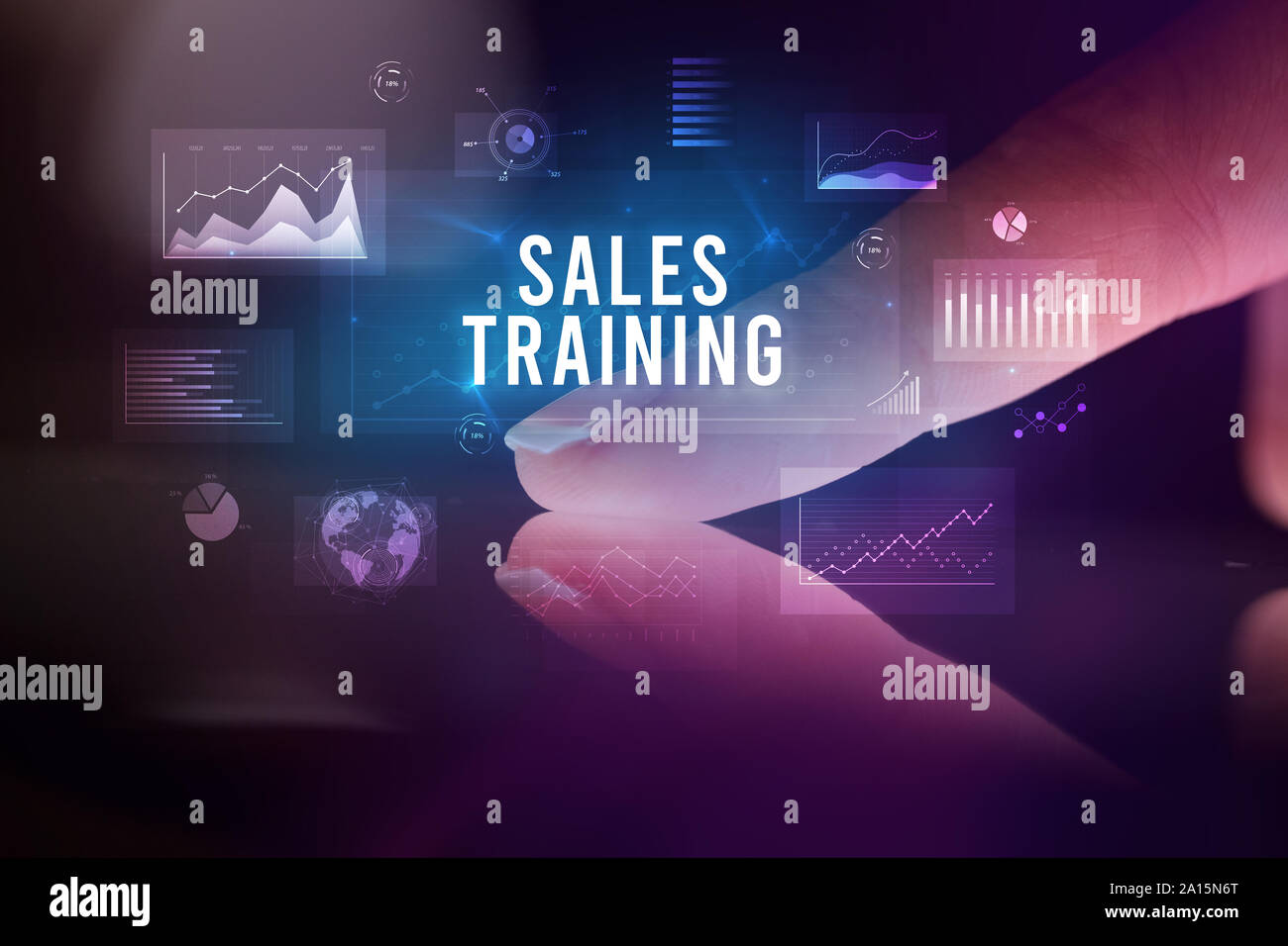 Finger touching tablet with charts and SALES TRAINING inscription ...