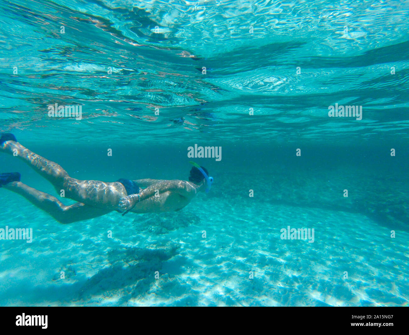 Sub with mask swimming, diving and exploring underwater in the ...