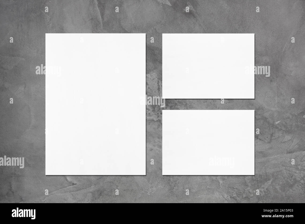 One empty white vertical a4 sized poster and two a5 sized horizontal ...