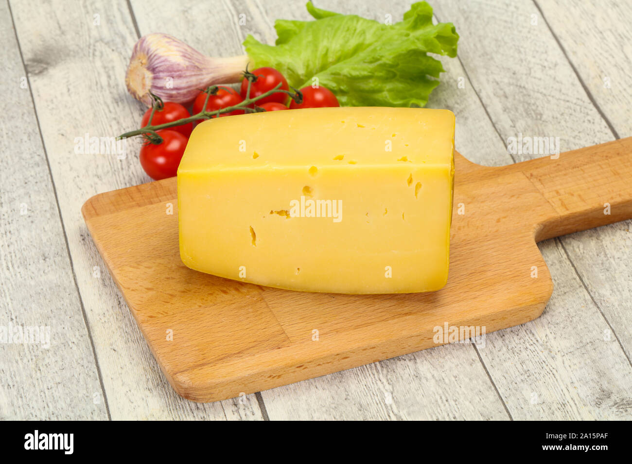 Swiss Hard yellow tasty cheese brick Stock Photo - Alamy