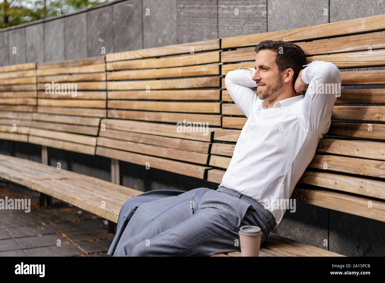 Man sitting bench behind hi-res stock photography and images - Alamy