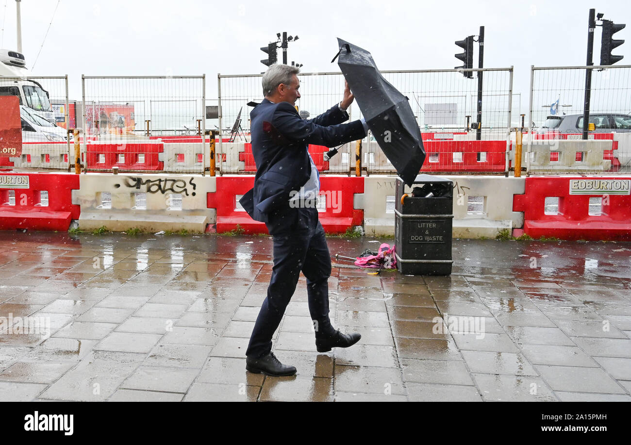 Struggling with wind hi-res stock photography and images - Alamy