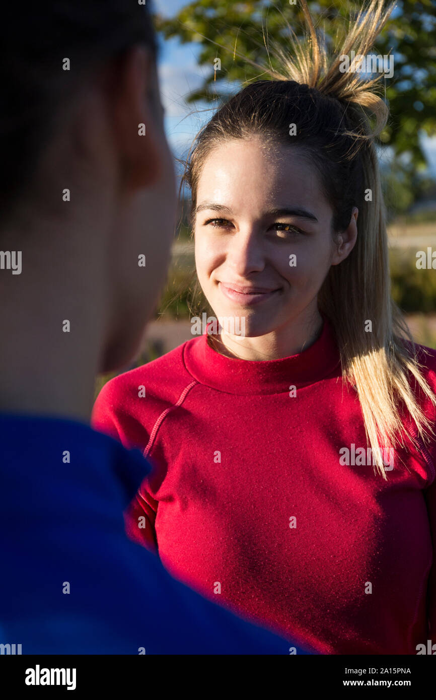 Young woman standing together, face to face Stock Photo - Alamy