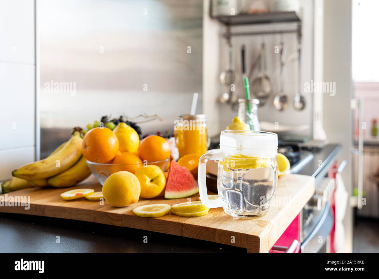 Lemon infusion on kitchen table with various fruit Stock Photo - Alamy
